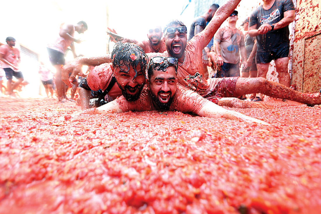 Streets awash in red for Tomatina party | News, Sports, Jobs - Altoona Mirror